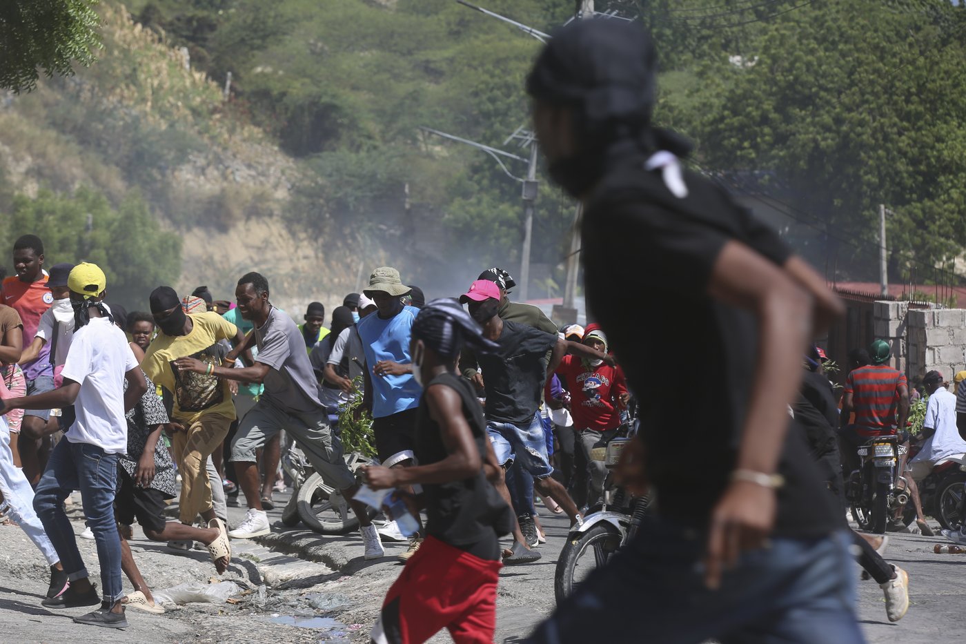 Haitian police tear-gas peaceful protesters as they demand help in ...
