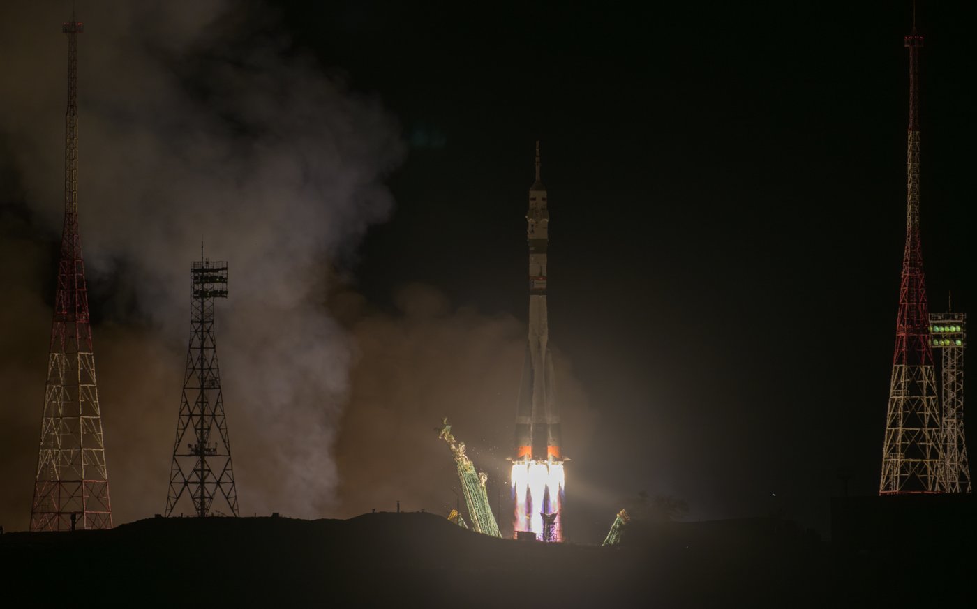 A Soyuz craft with 2 Russians and 1 American docks at the International ...