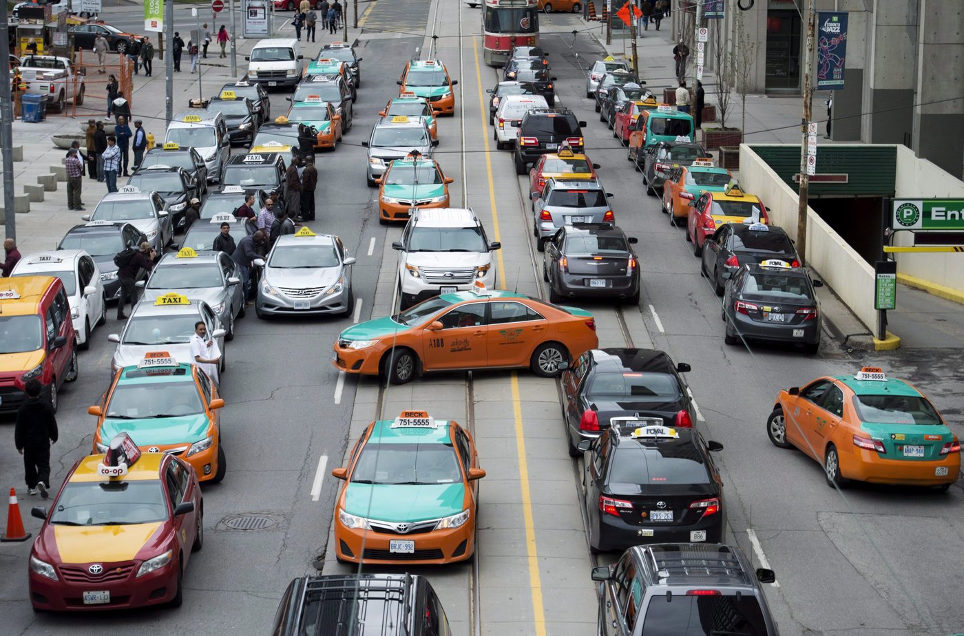 Toronto police charge 11 suspects in taxi scam investigation