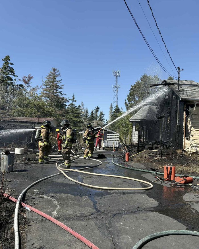 Fire crews tackled blaze that spread from home to garage and two sheds